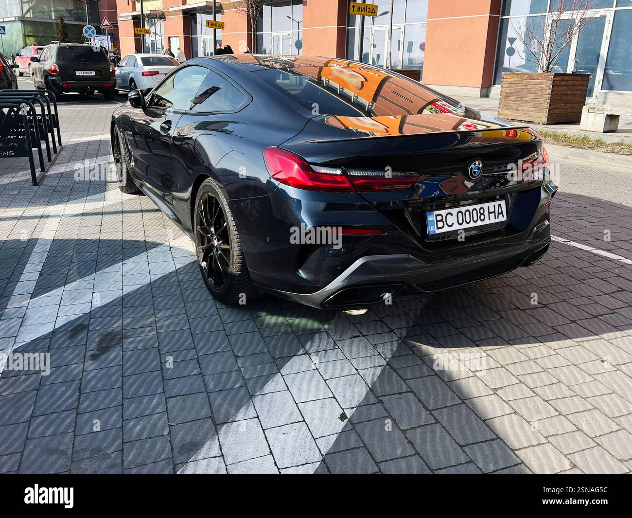 Lviv, Ukraine - February 12, 2025: Close-up view of a black luxury BMW 8 Series car parked ...