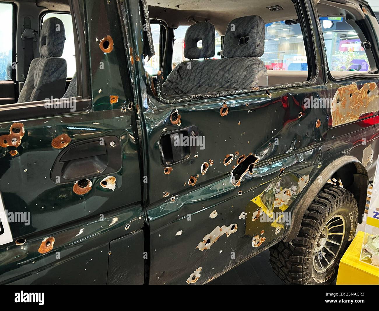 Lviv, Ukraine - February 12, 2025: Damaged military vehicle displaying ...