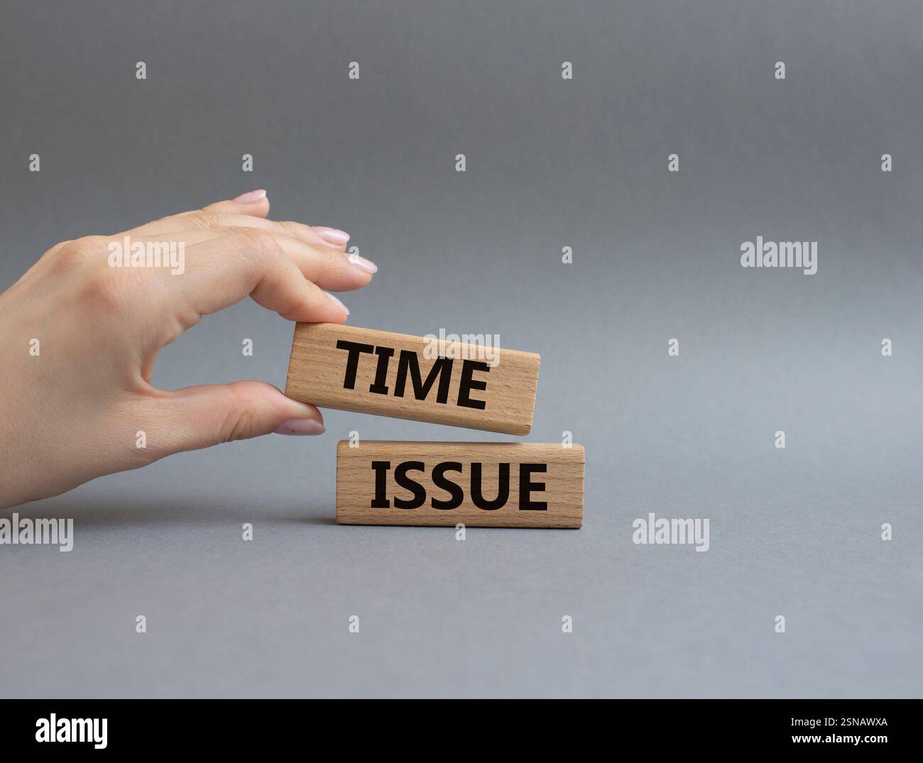 Time issue symbol. Wooden blocks with words Time issue. Beautiful grey ...