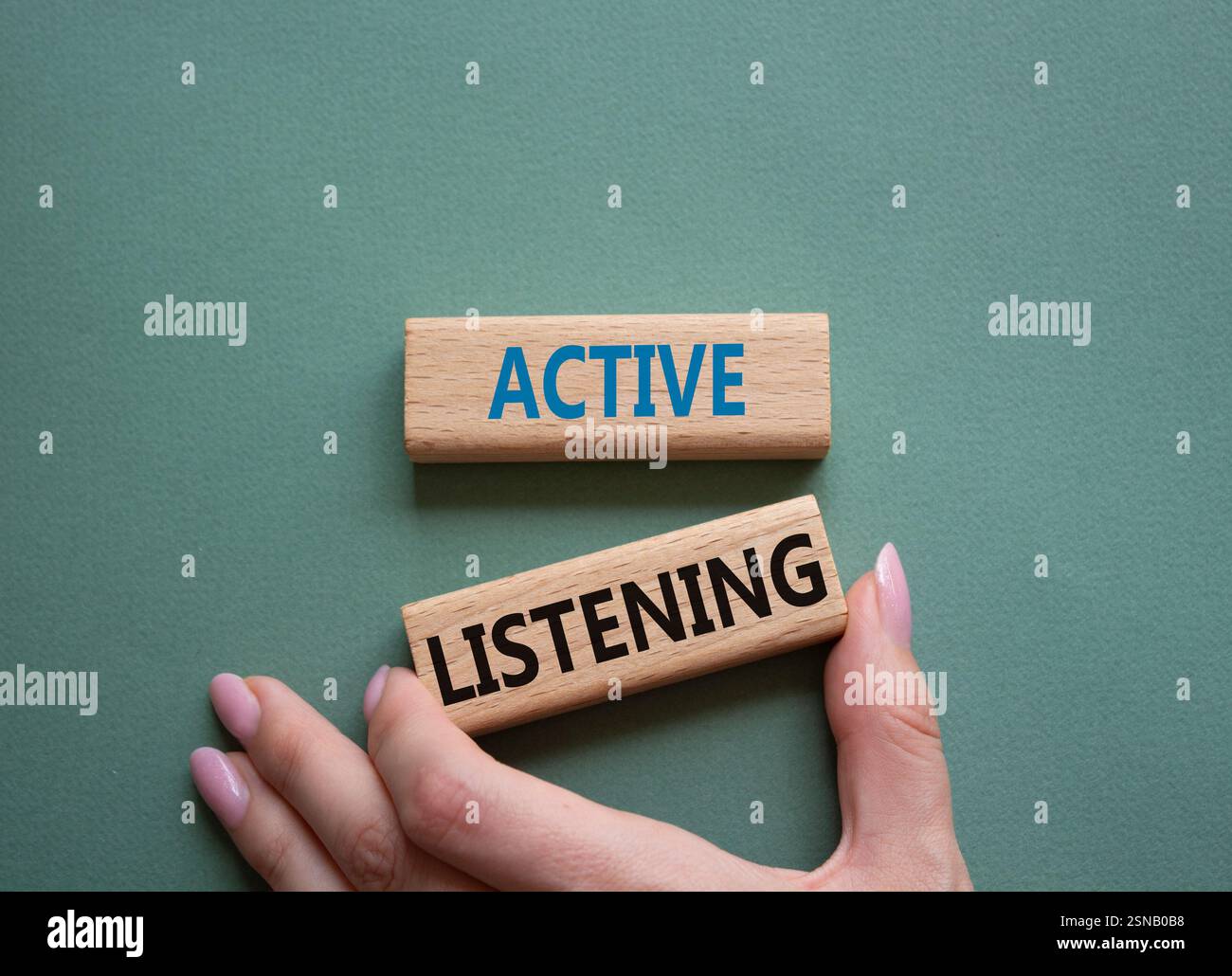 Active listening symbol. Wooden blocks with words Active listening ...