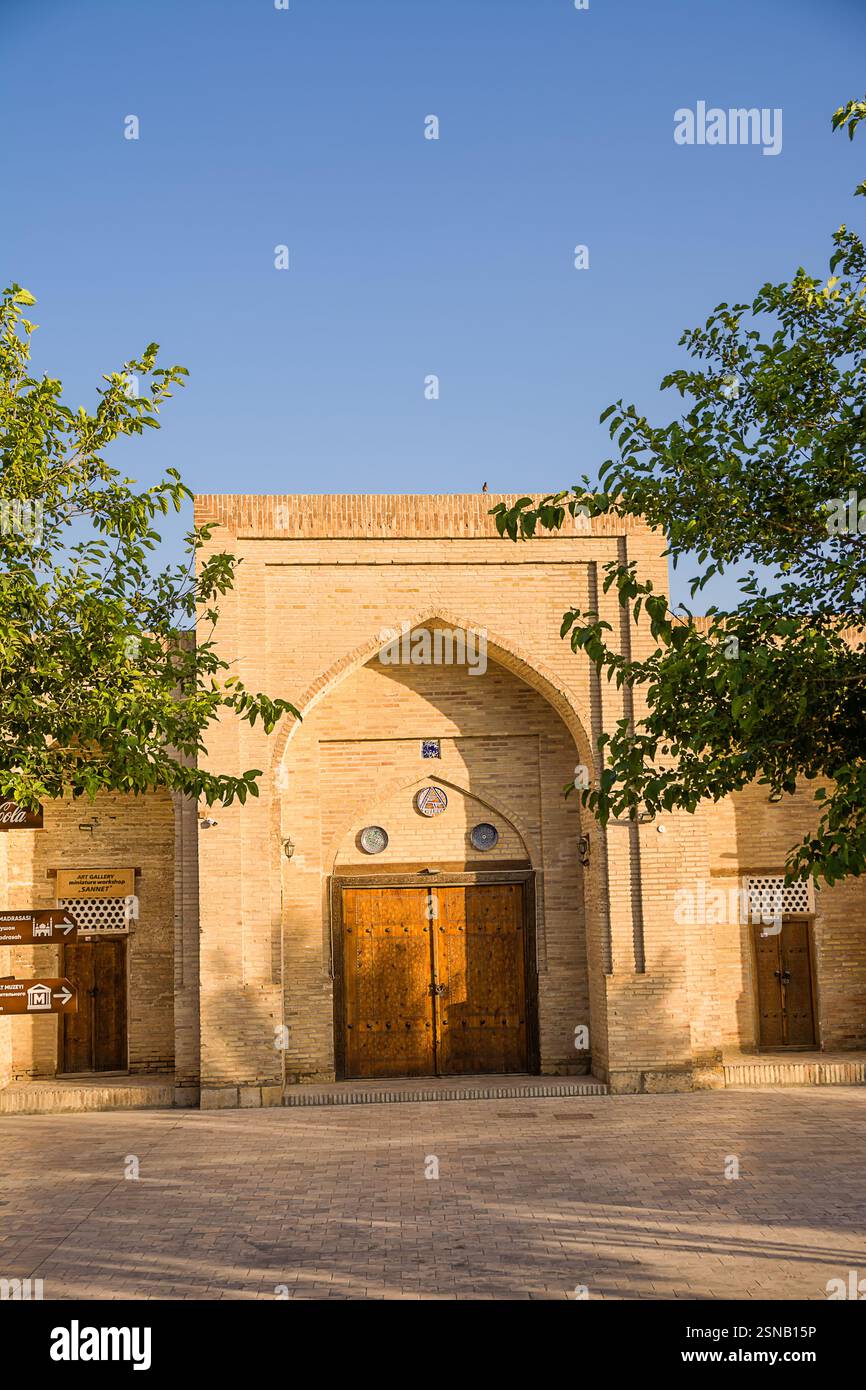 Bukhara, Uzbekistan - 08 July 2024: Typical entrance of a building with ...