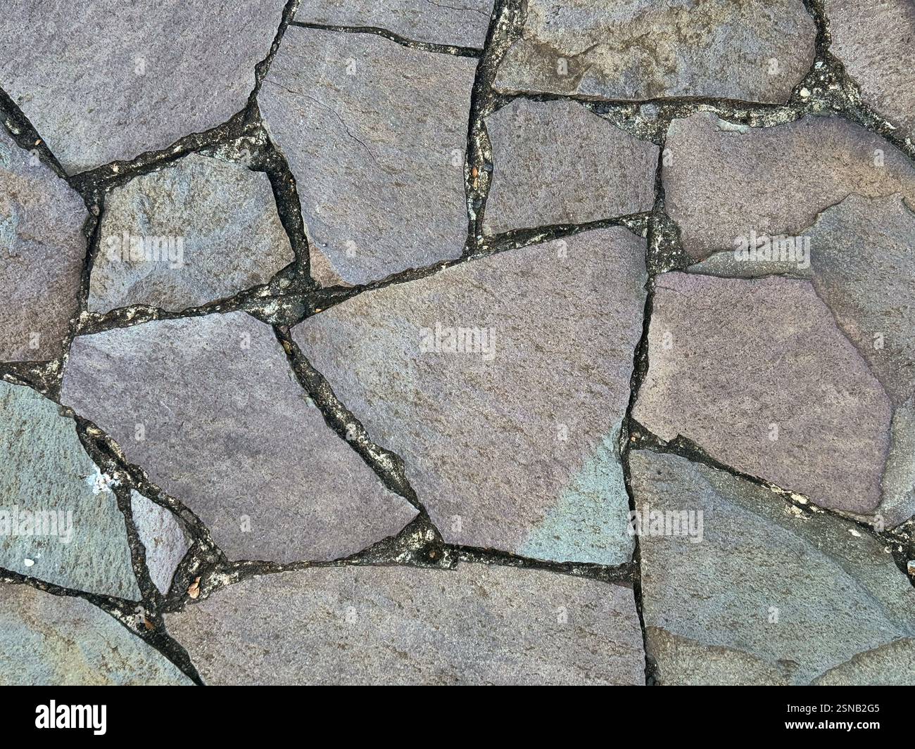 Natural random cut grey flagstone flattened on a surface. Or a series ...