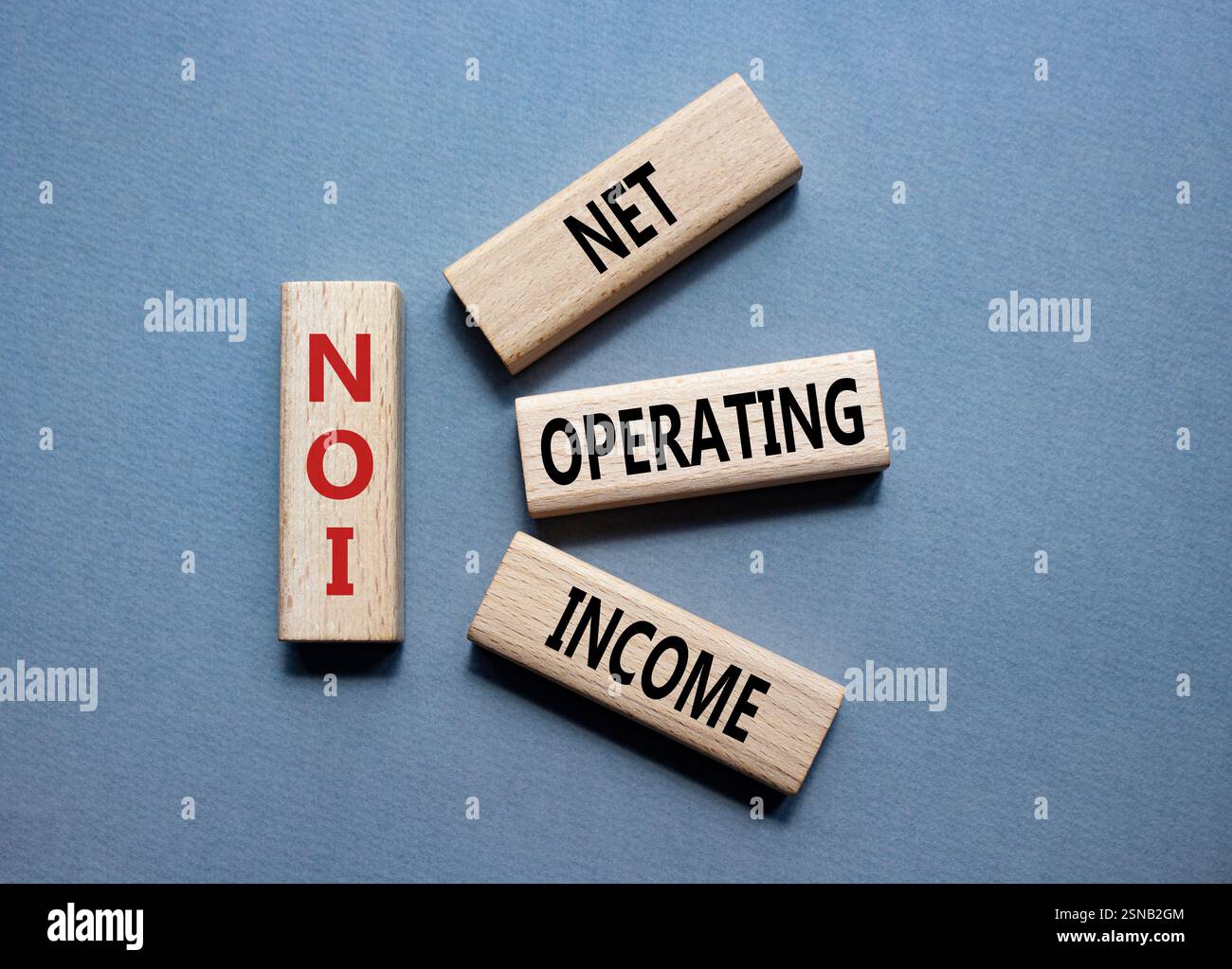 NOI - Net Operating Income symbol. Concept word NOI on wooden cubes ...