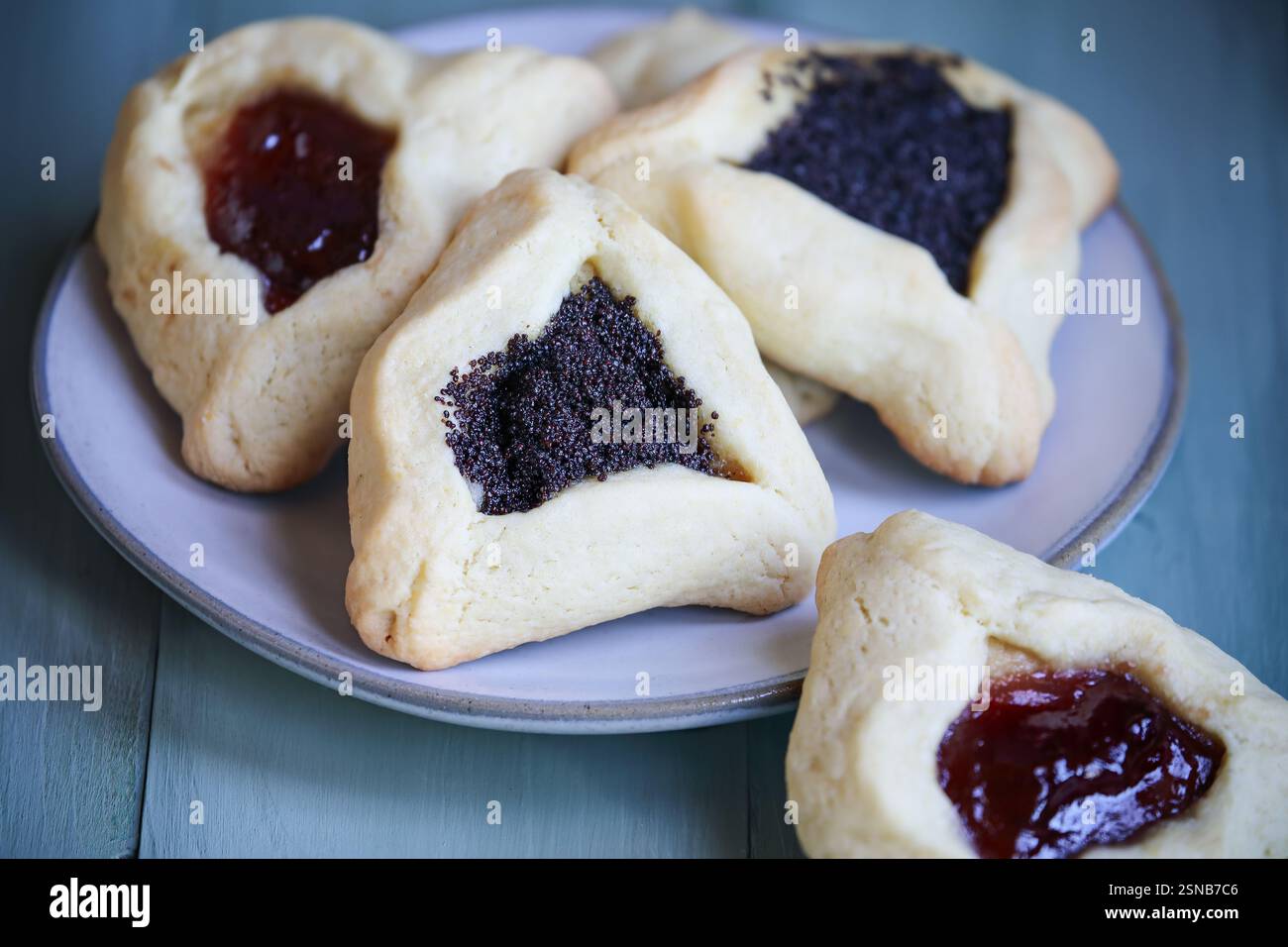 Variety of traditional hamantaschen cookies filled with mohn paste ...