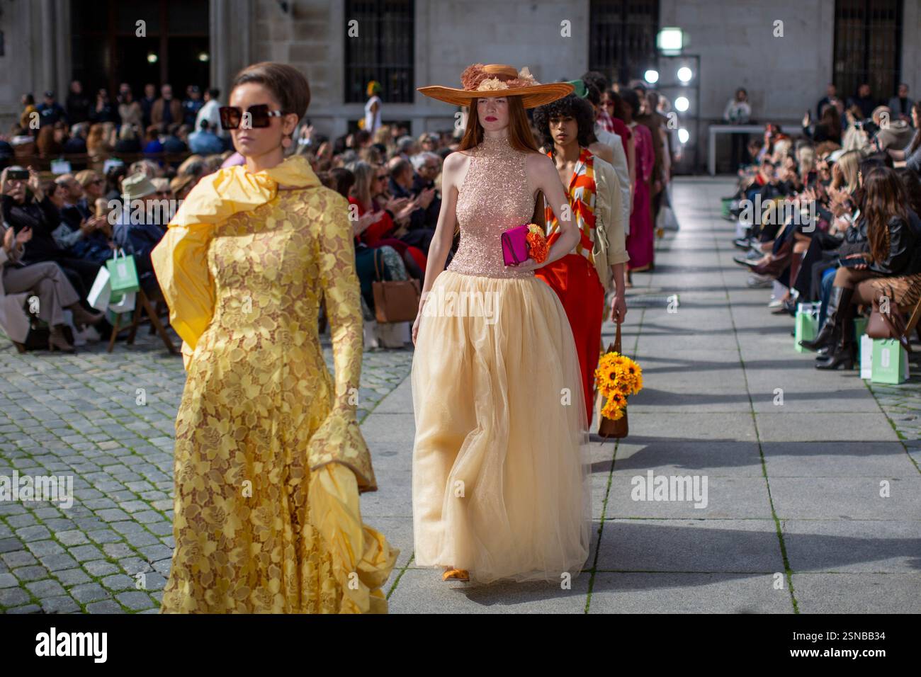 Madrid, Spain. 13th Feb, 2025. Models walk the catwalk, during the ...