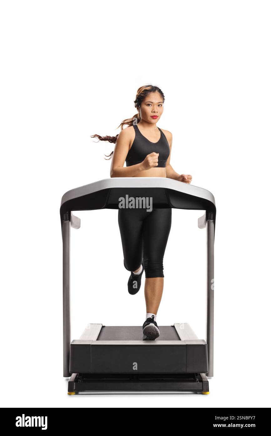 Front view of an asian woman training on a treadmill isolated on white ...