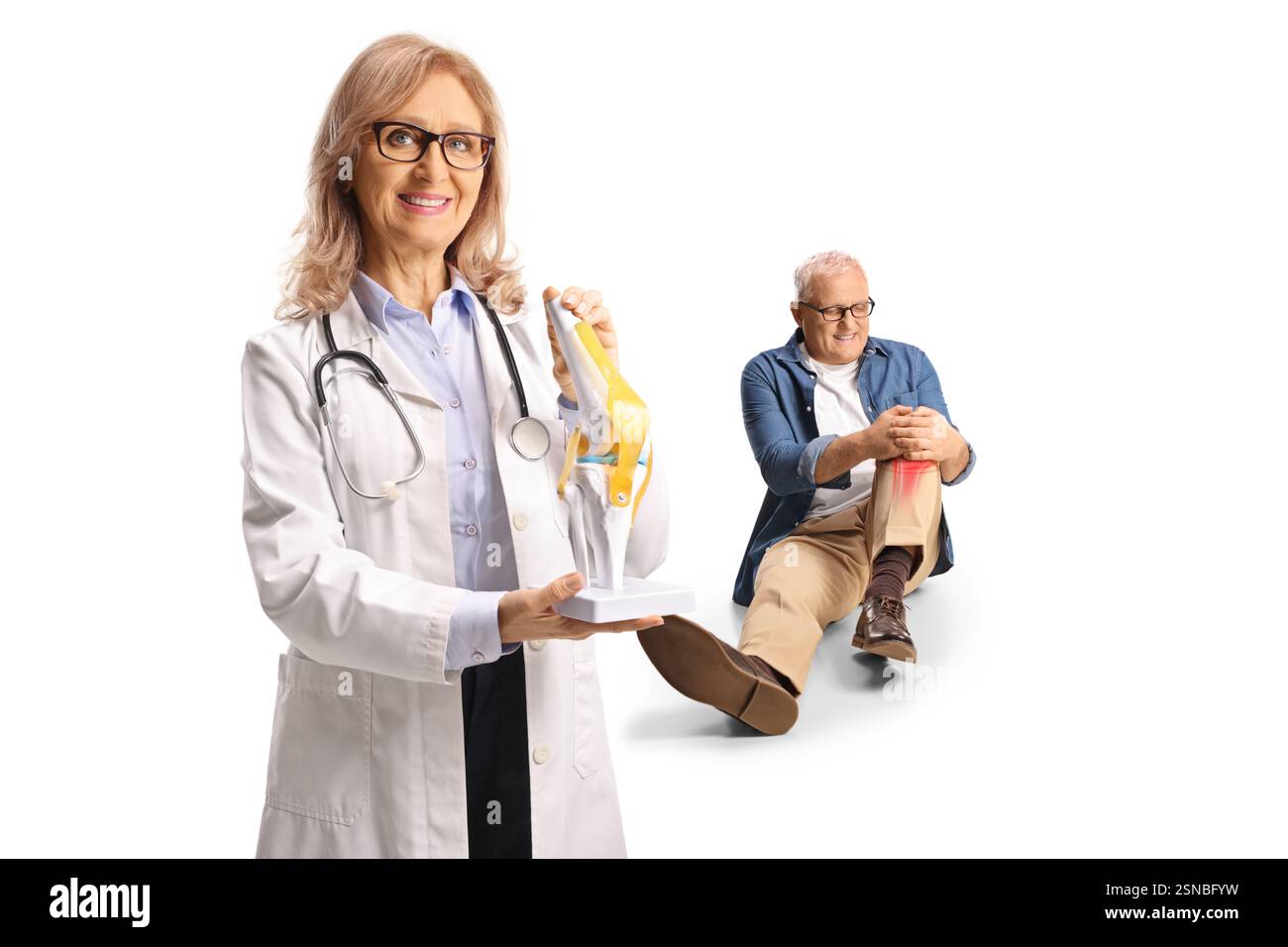 Female doctor holding a knee bone model and man with leg injury sitting ...