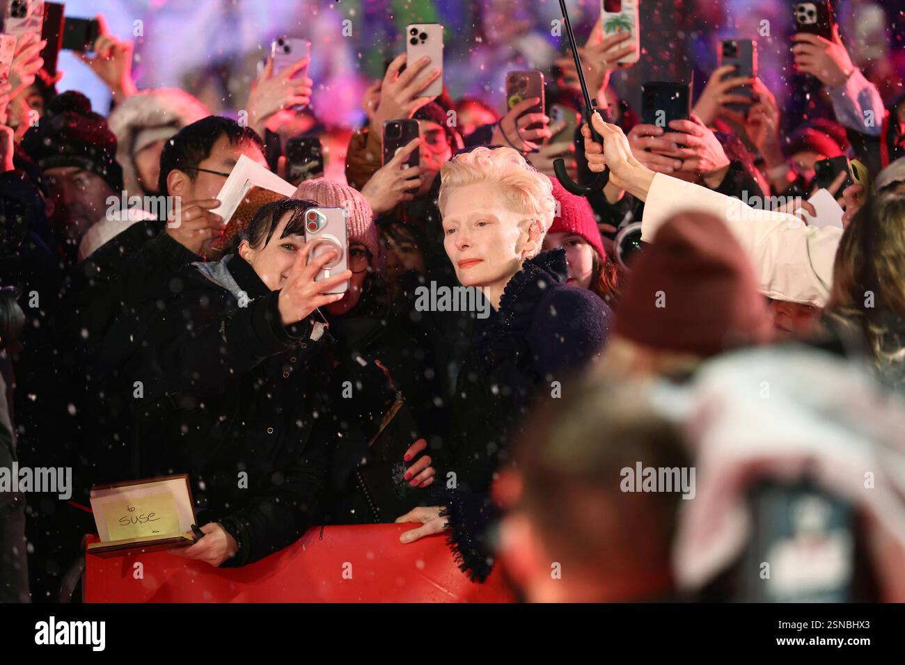 Actress Tilda Swinton poses for photos with fans upon arrival at the ...