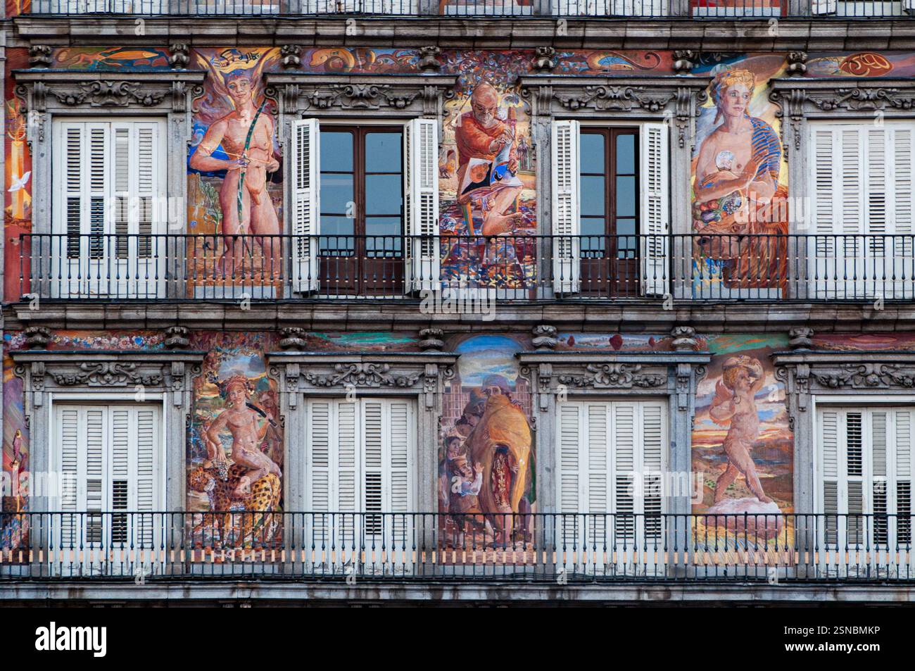 Detail of the colorful frescoes on the side of a building in the Plaza ...