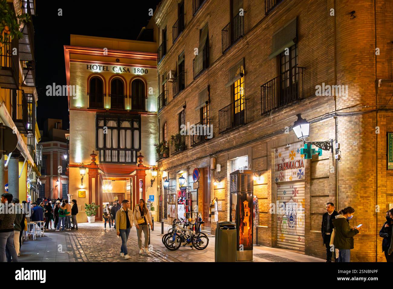 The illuminated streets of shops and cafes in the historic Barrio Santa ...