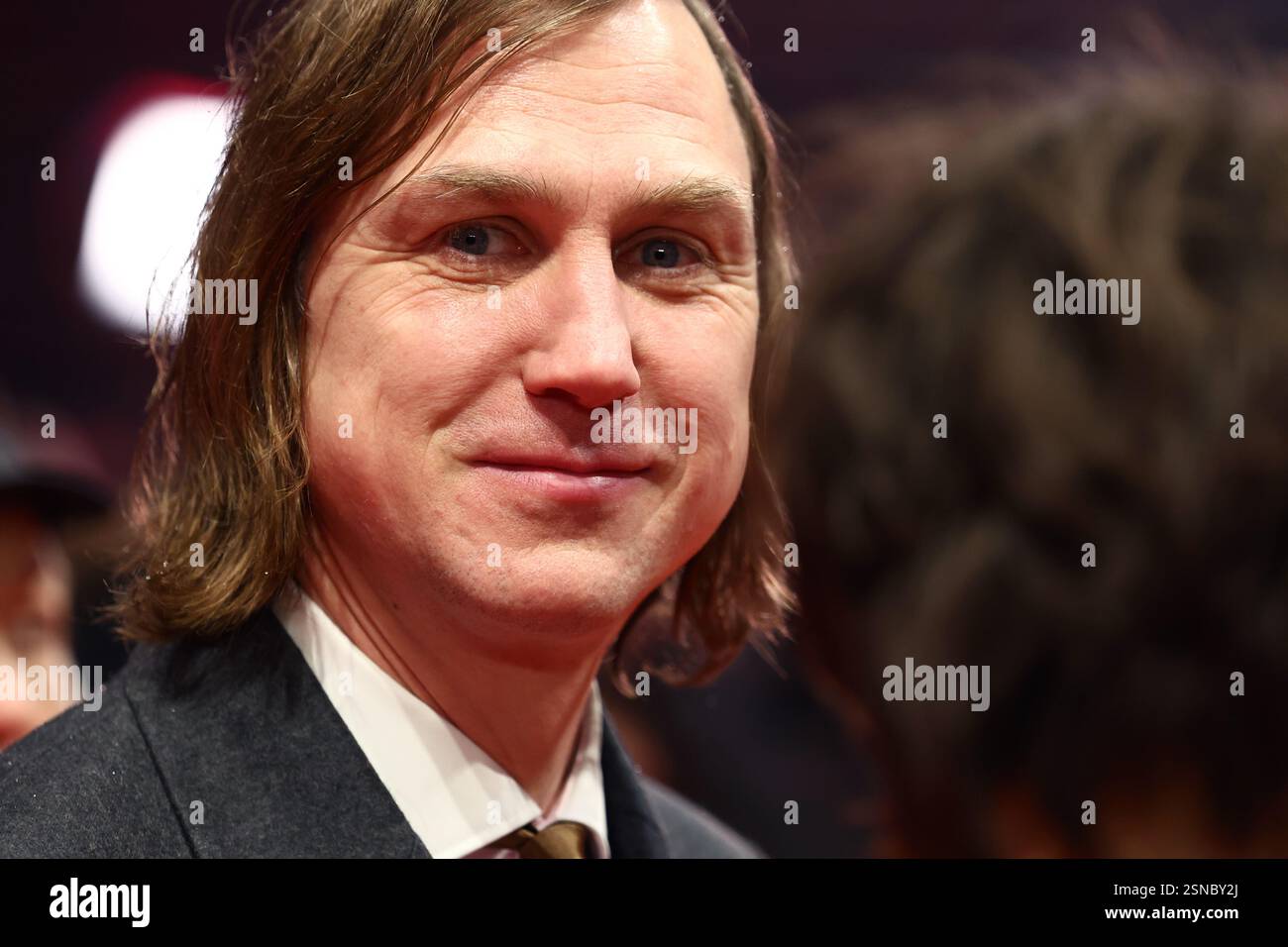 Berlin, Germany. 13th Feb, 2025. Lars Eidinger, actor, stands on the red carpet on the opening ...