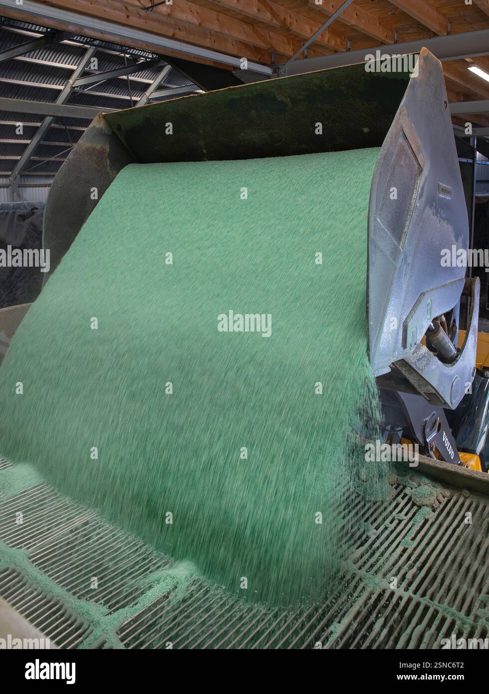 Shovel working in a distribution and storage centre for fertilizers ...