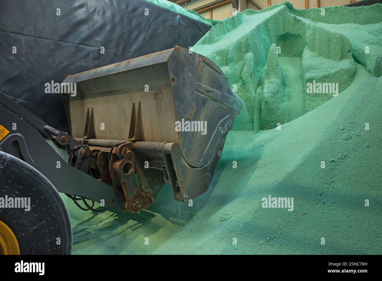 Shovel working at a distribution and storage centre for fertilizers ...