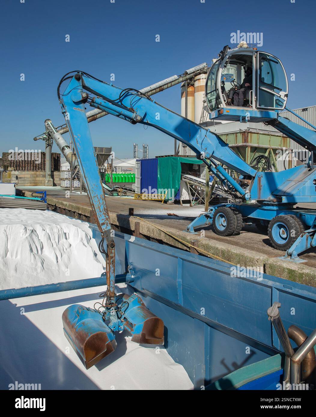 Unloading a ship with chalk. At a distribution and storage centre for ...