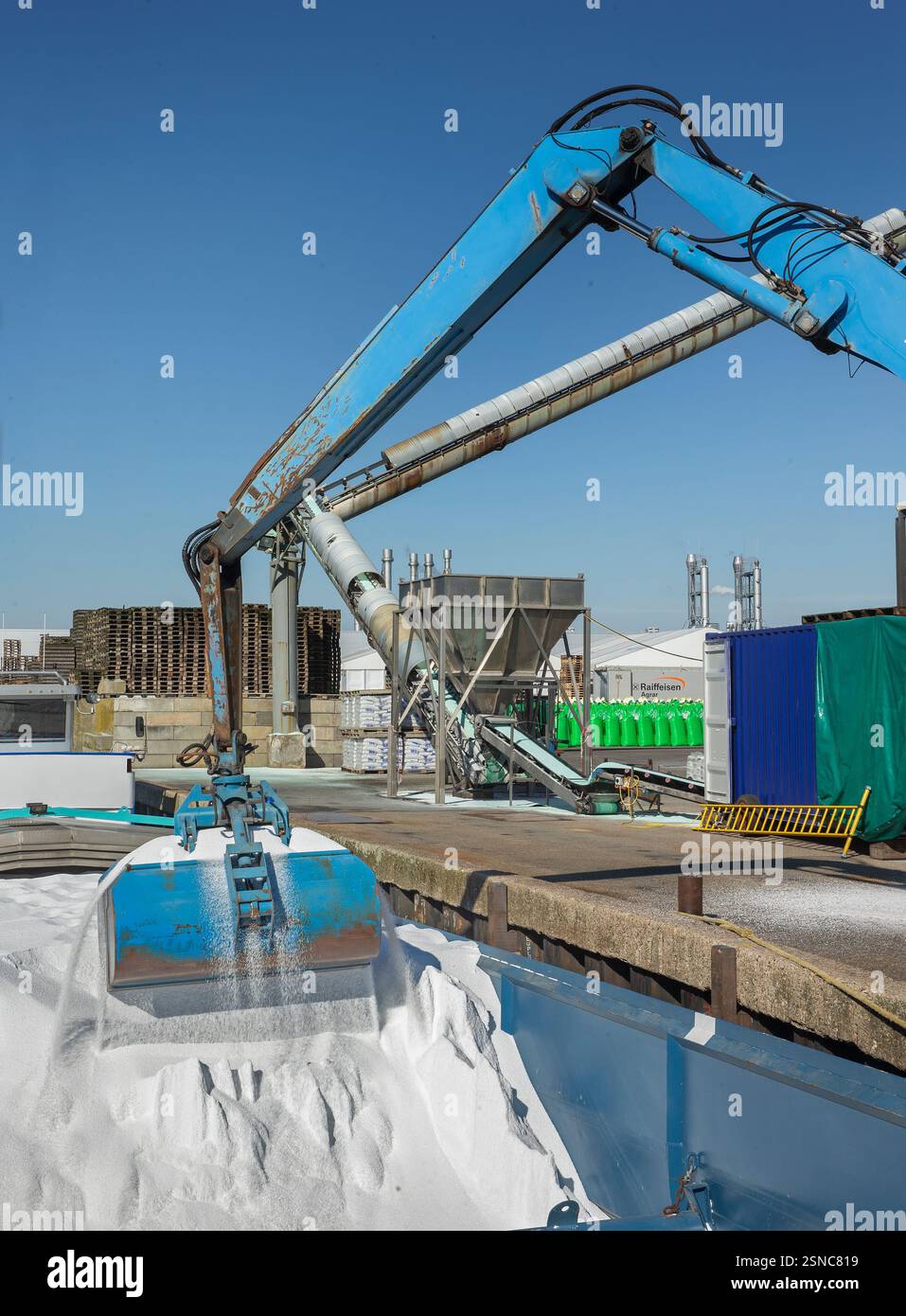 Unloading a ship with chalk. At a distribution and storage centre for ...