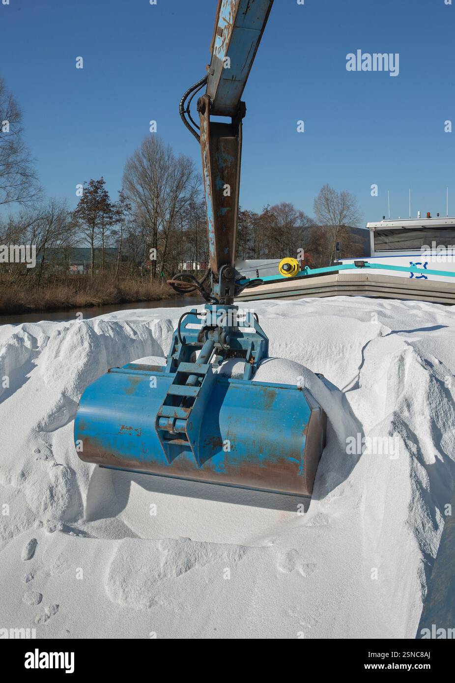 Unloading a ship with chalk. At a distribution and storage centre for ...