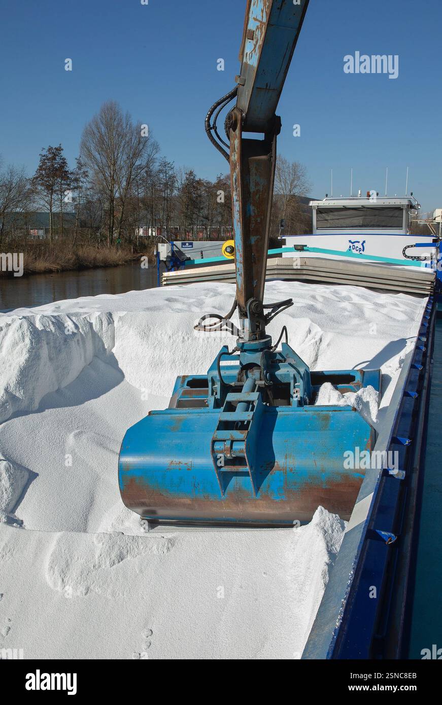 Unloading a ship with chalk. At a distribution and storage centre for ...