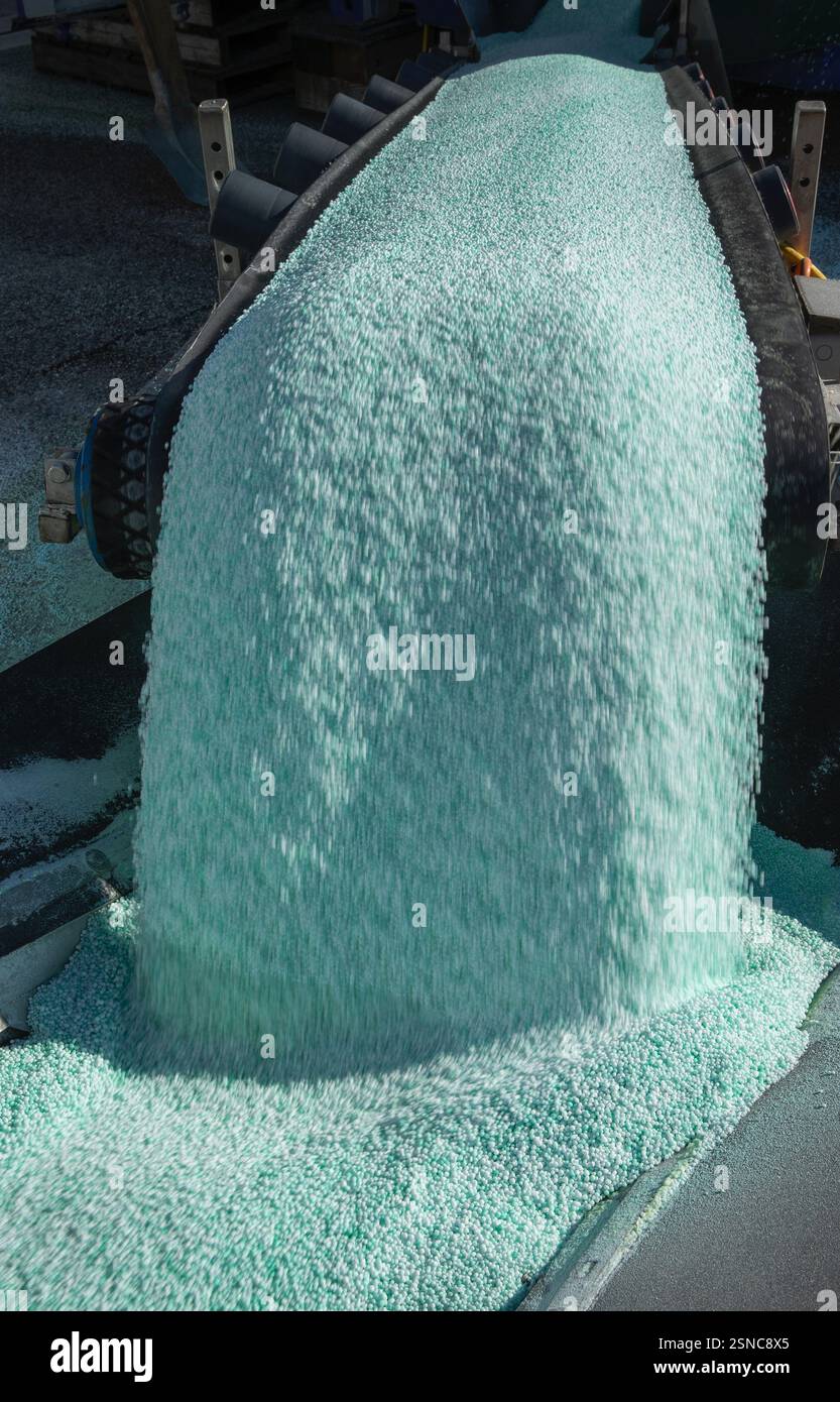 Conveyor belt at factory with fertilzer. At a distribution and storage ...