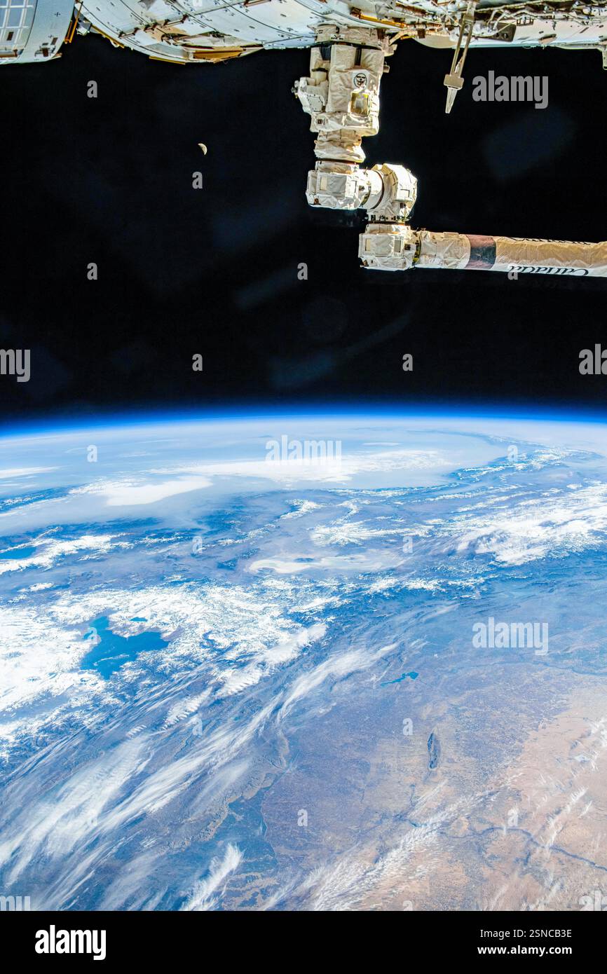 The moon, the ISS, and Planet Earth,Digital enhancement of an image by ...