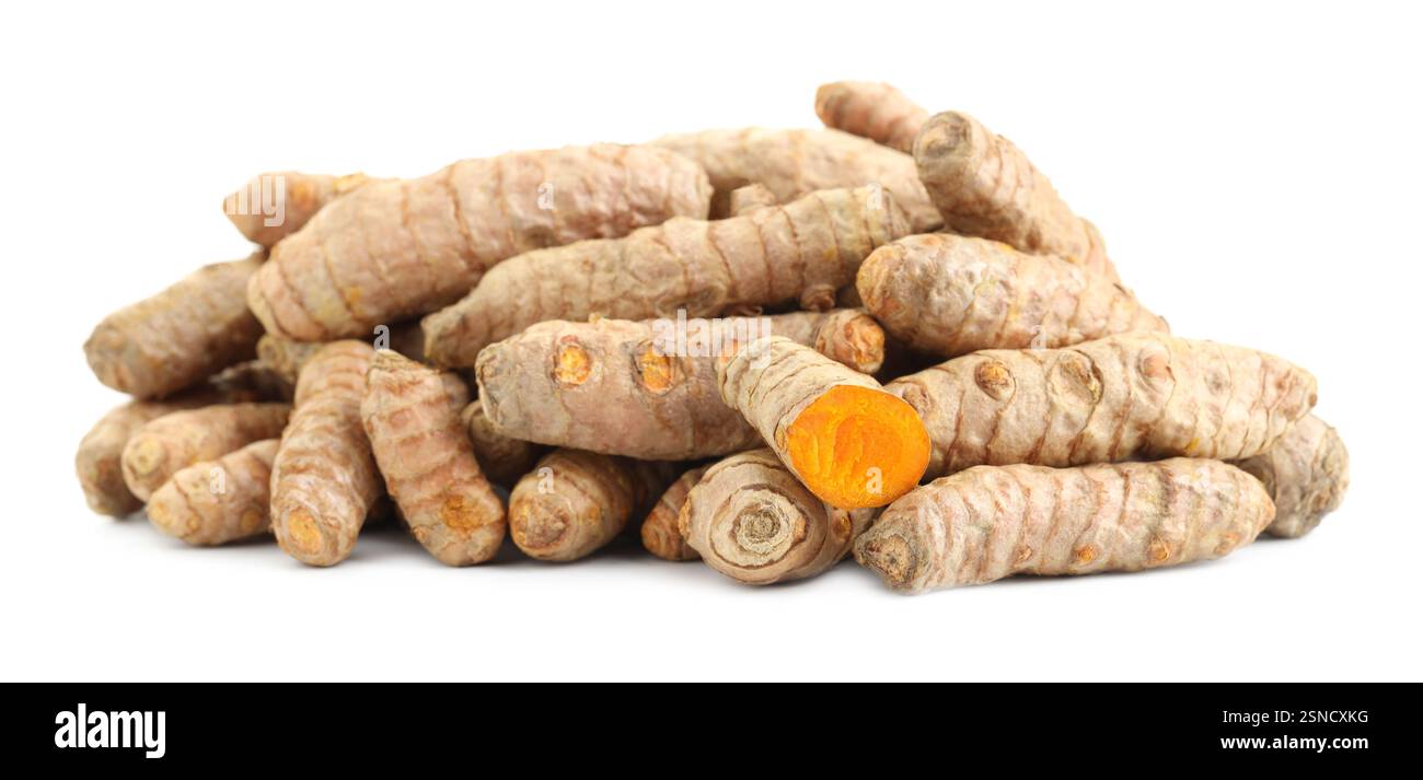 Pile of fresh turmeric roots isolated on white Stock Photo - Alamy