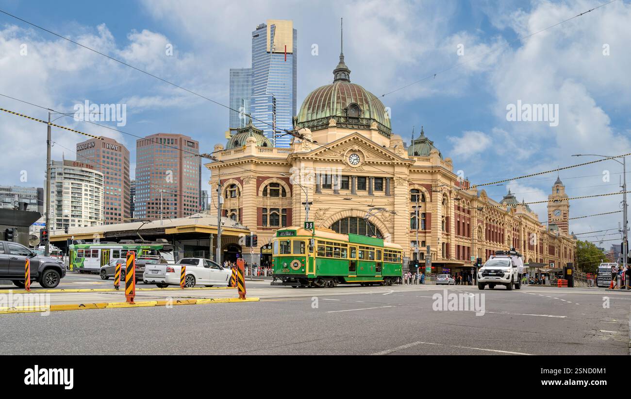 Vintage tram crossing the intersection Swanston and Flinders Street ...