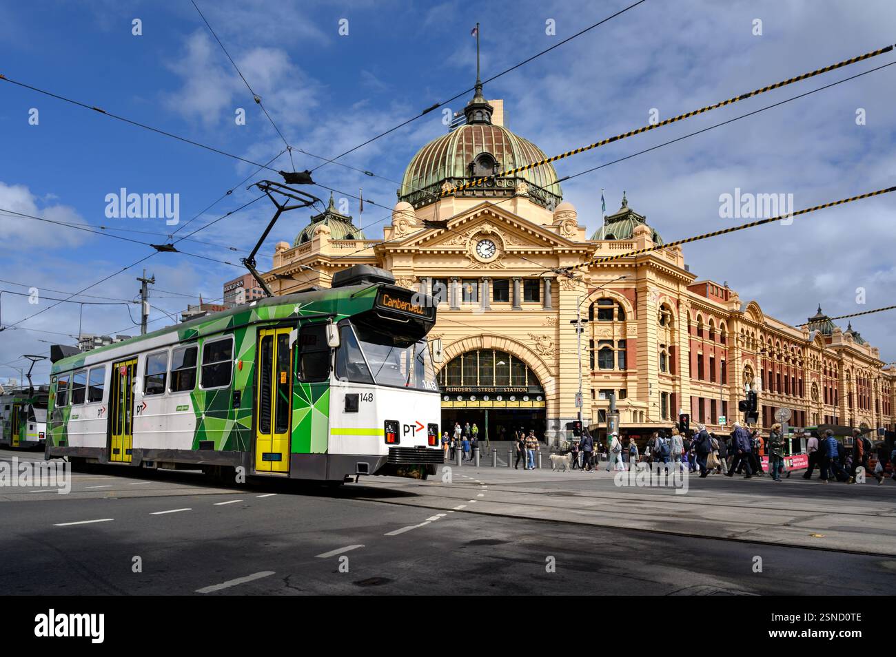 A tram crossing the intersection Flinders Street Station and Swanston ...