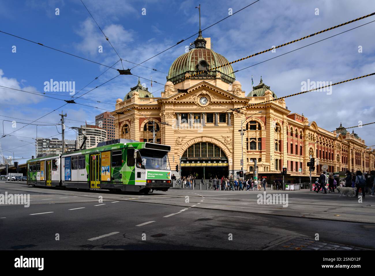 A tram crossing the intersection in front of Flinders Street Station ...