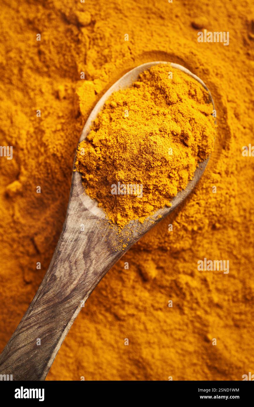 Ground turmeric root powder on a spoon, top view Stock Photo - Alamy