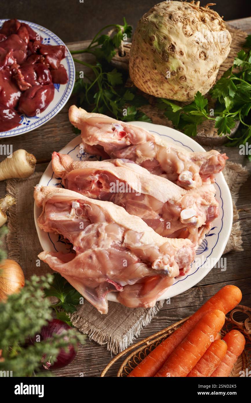 Chicken backs, liver and fresh vegetables - Ingredients for making ...