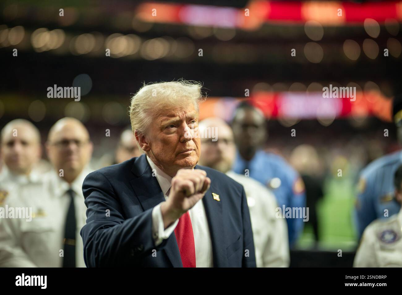 President Donald J. Trump attends Superbowl LIX between the ...