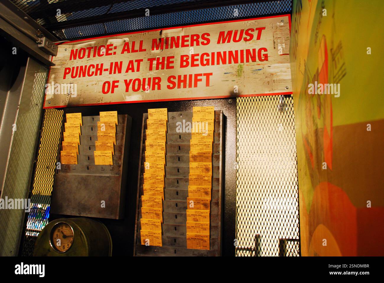 Time cards hang near an elevator shaft for miners to punch in before ...