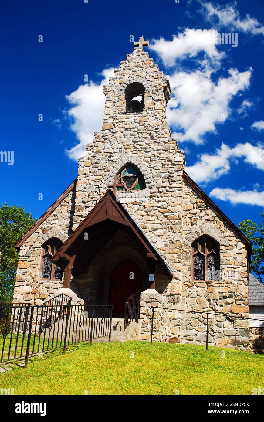 A small stone church sits on a humble lot Stock Photo - Alamy