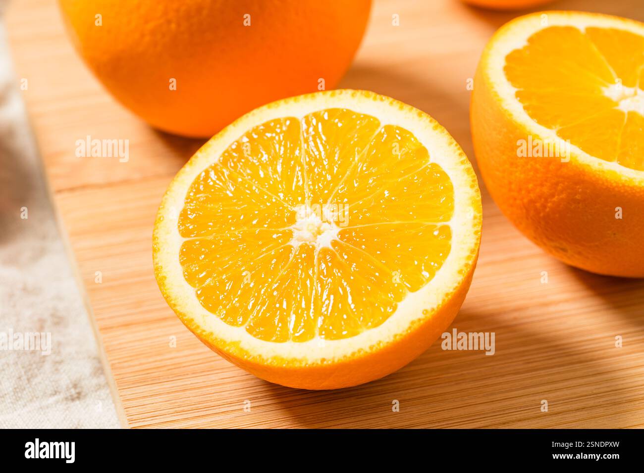 Raw Organic Sweet Oranges Cut in Half Ready to Eat Stock Photo - Alamy