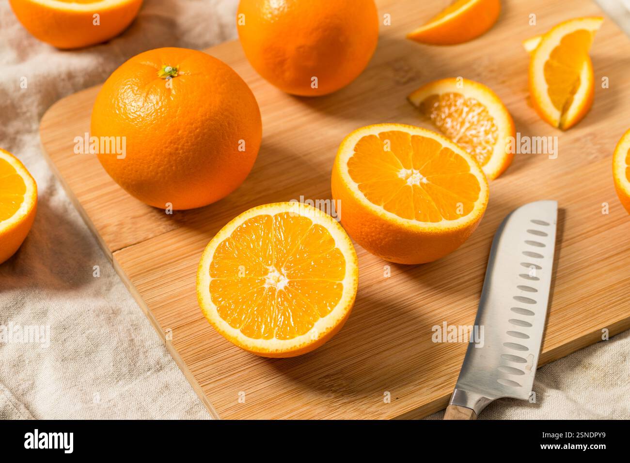 Raw Organic Sweet Oranges Cut in Half Ready to Eat Stock Photo - Alamy