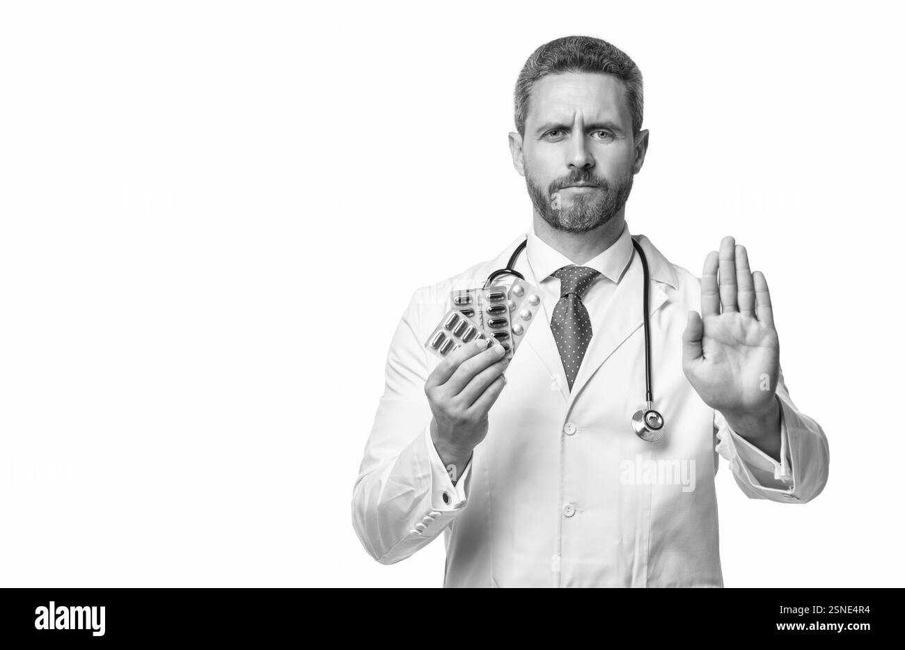 stop the pills. doctor hold pill with stop gesture. stop taking ...