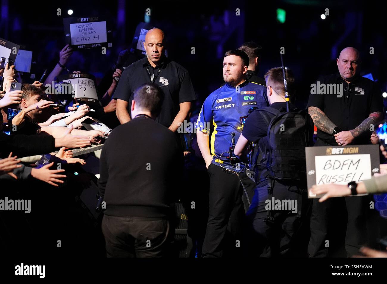 Luke Littler walks out to play Rob Cross on night two of the 2025 ...