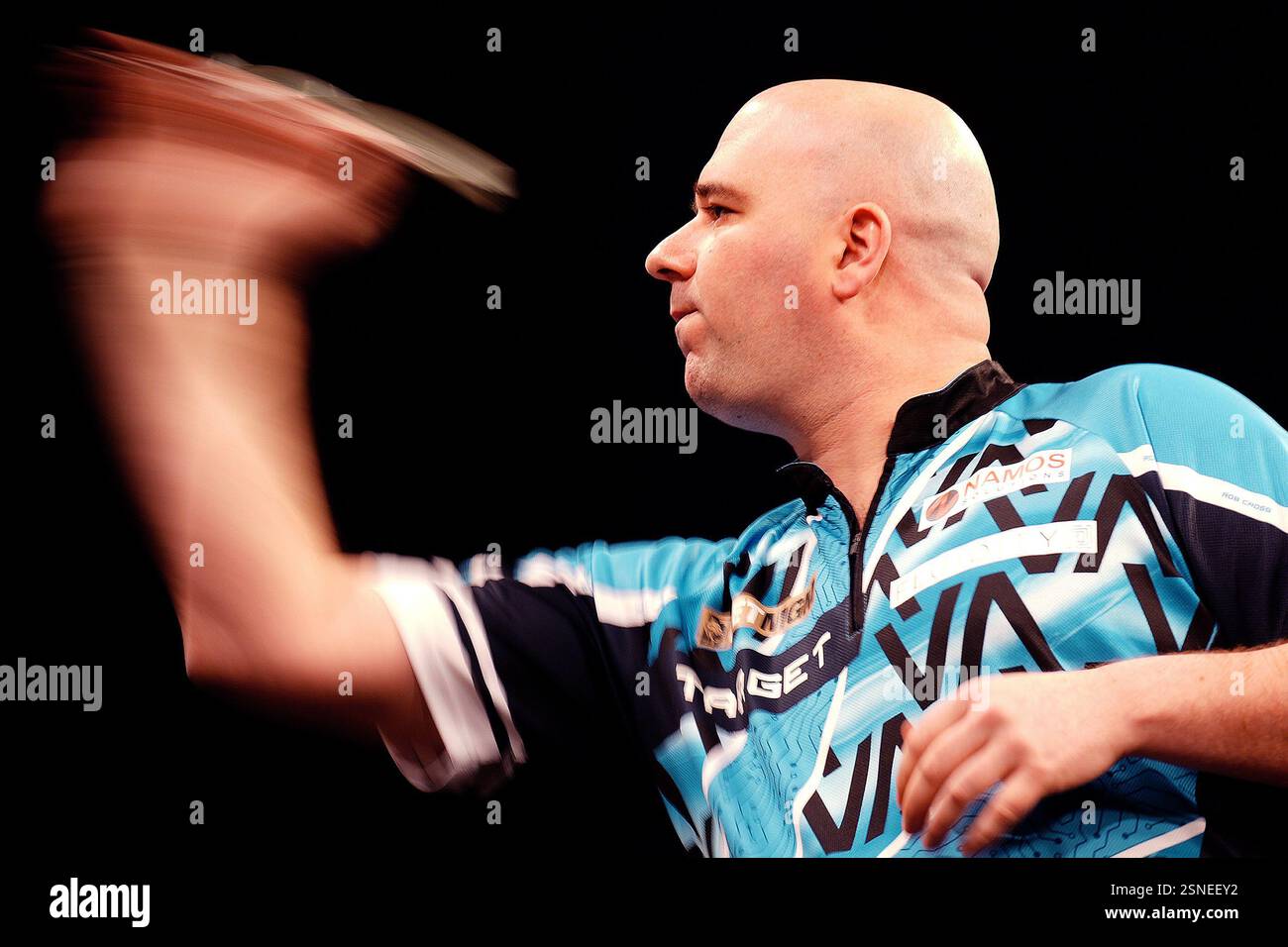 Rob Cross in action against Luke Littler on night two of the 2025 ...