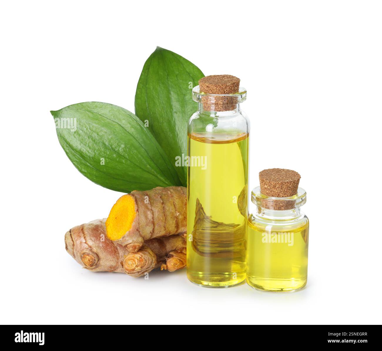 Bottles of turmeric essential oil, raw roots and leaves isolated on ...