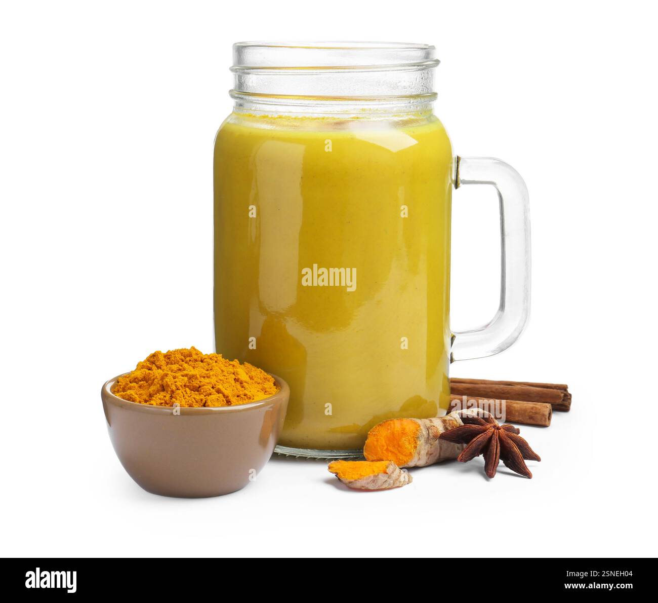 Delicious turmeric latte in mason jar and spices isolated on white ...