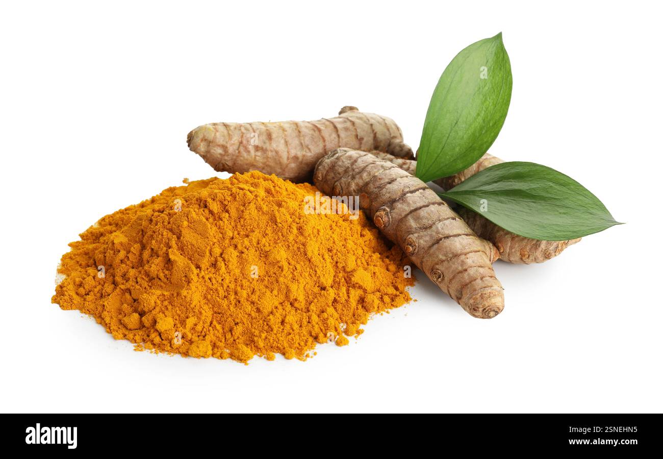 Pile of turmeric powder, roots and green leaves isolated on white Stock ...