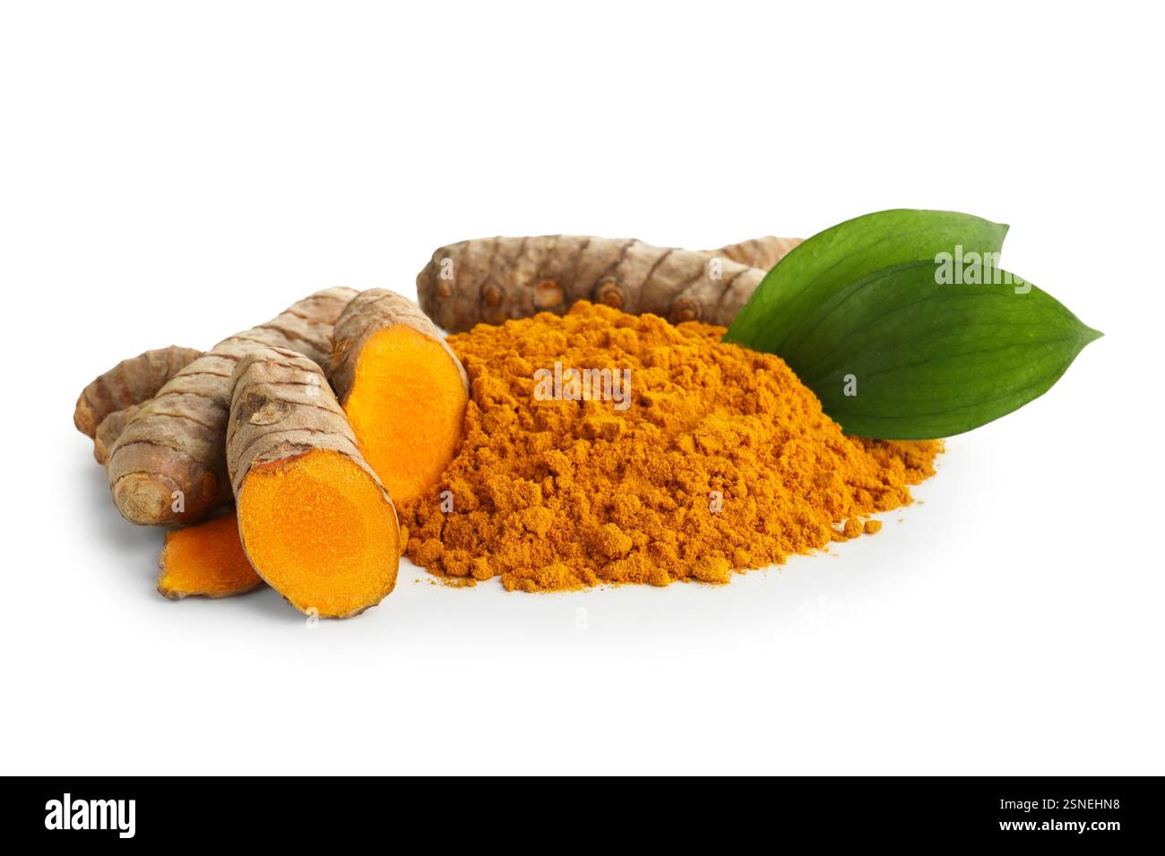 Pile of turmeric powder, roots and green leaves isolated on white Stock ...