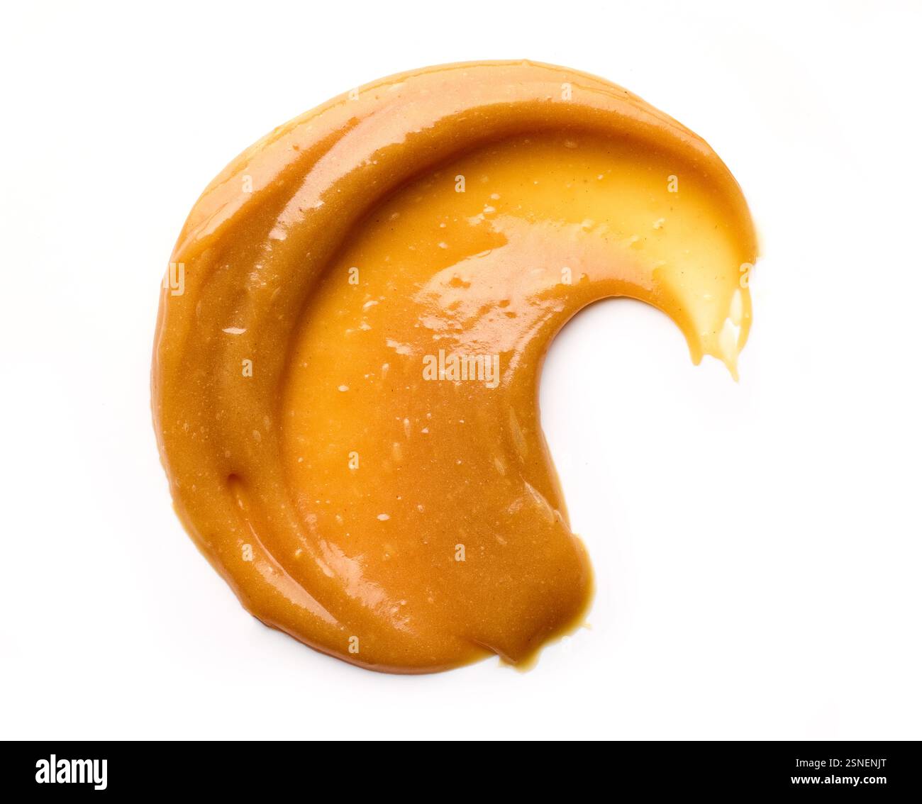 Smear of tasty caramel paste on white background, top view Stock Photo ...