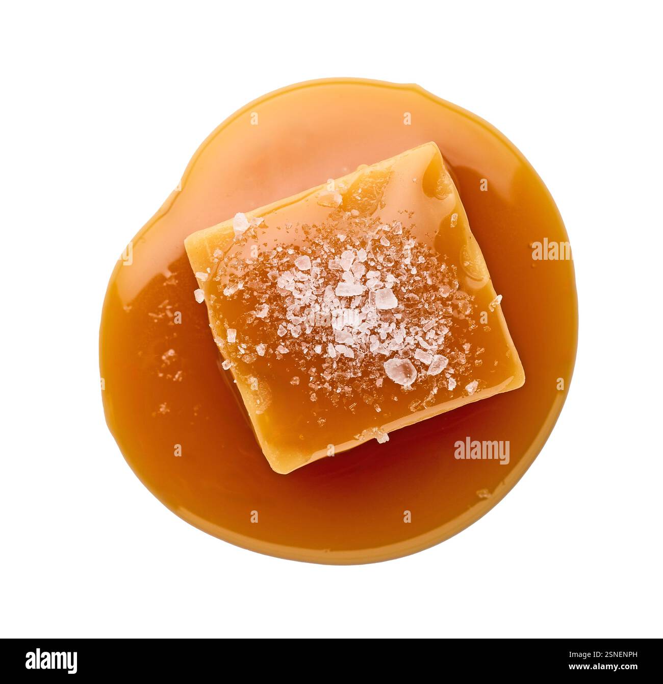 salted caramel candy in melted caramel sauce isolated on white ...
