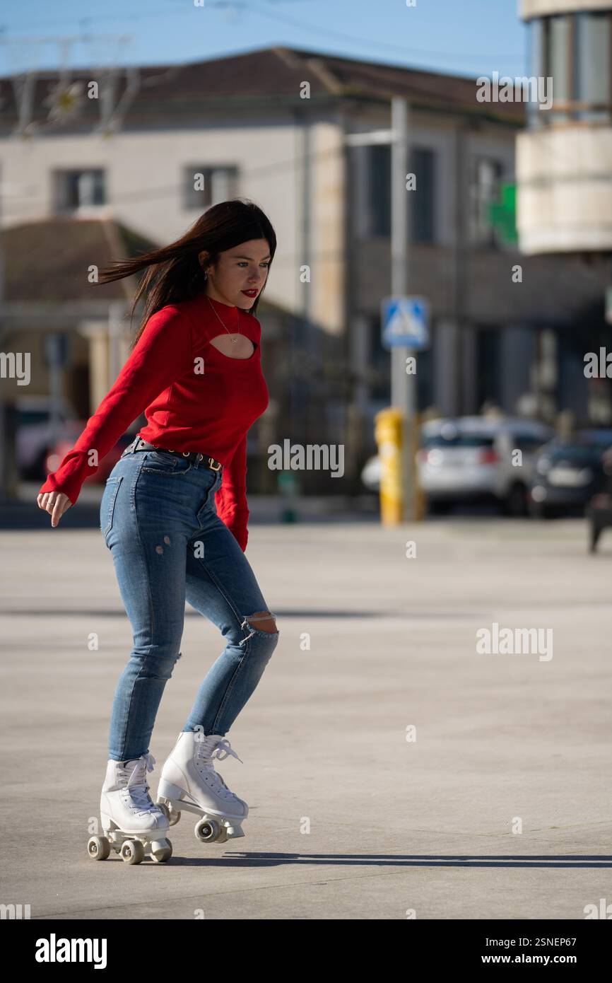 Young woman roller skating through hi-res stock photography and images ...