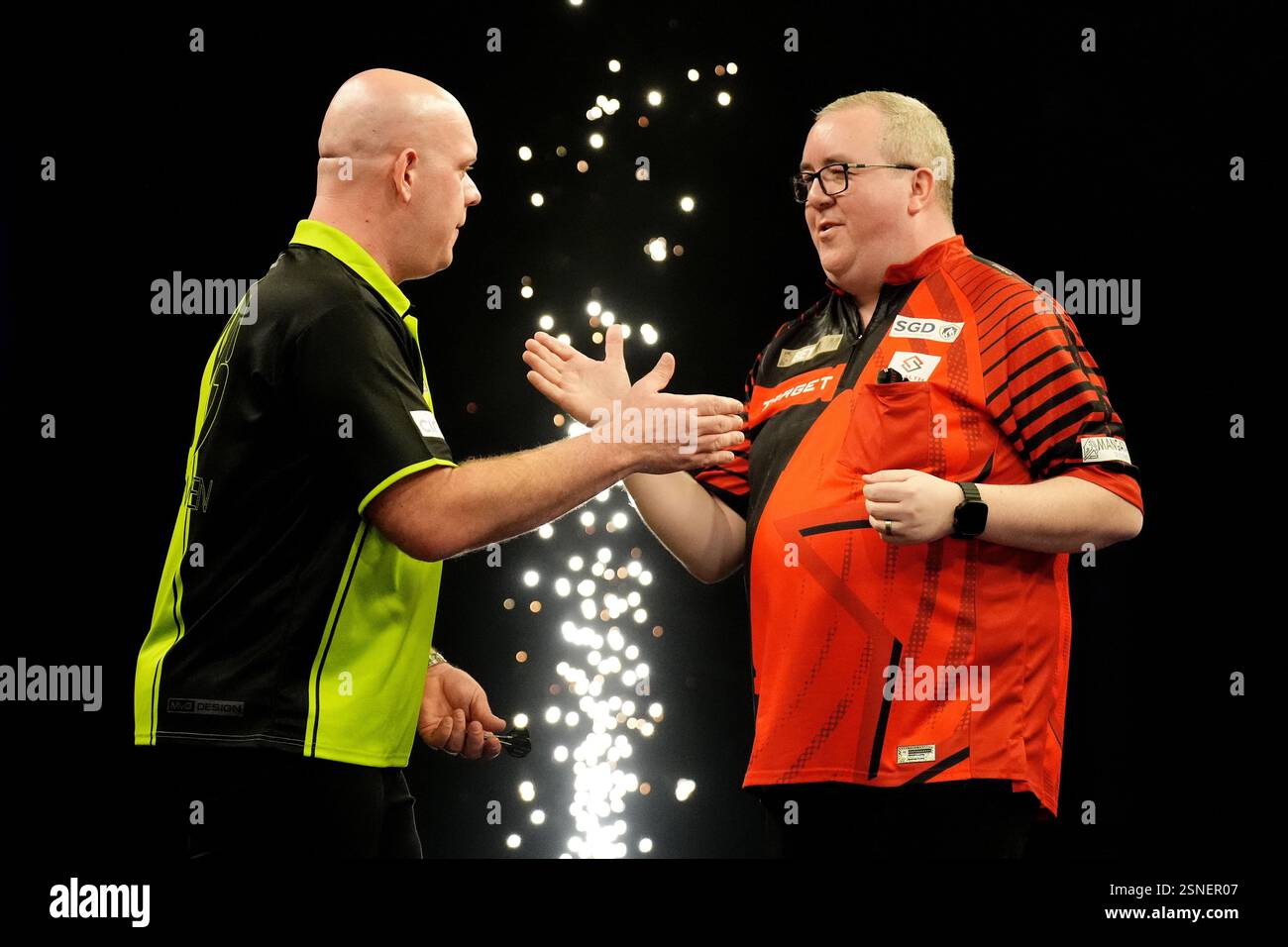 Michael van Gerwen (left) embraces Stephen Bunting after their match on ...