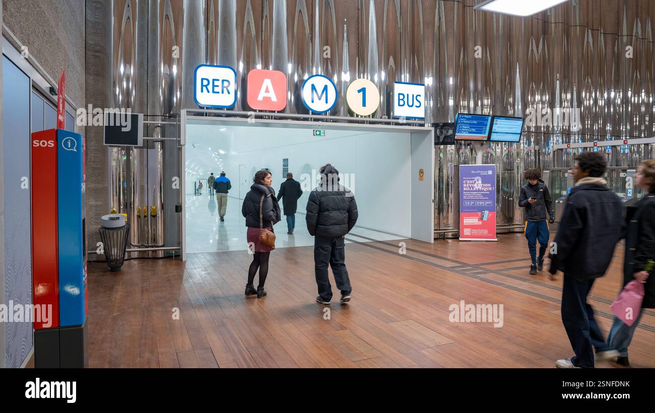 Busy commuters navigating the modern transit hub in a bustling city ...