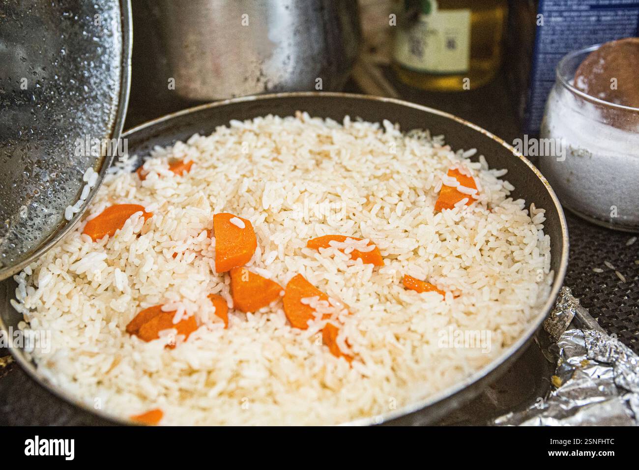 Carrot in white rice on the stove hi-res stock photography and images ...