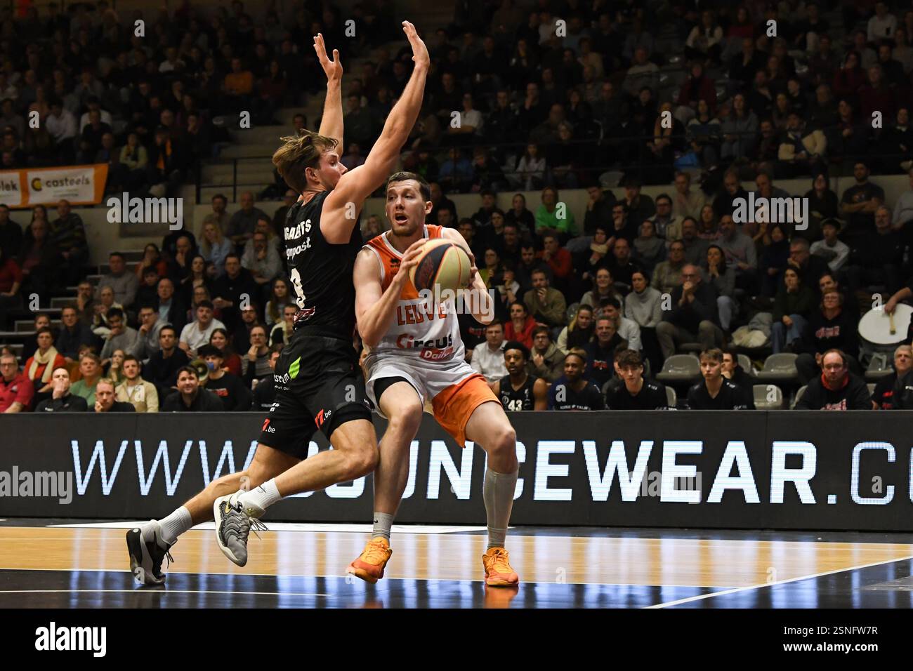 Leuven, Belgium. 13th Feb, 2025. Kortrijk's Bram Bogaerts and Leuven's Noah Bauman pictured in ...