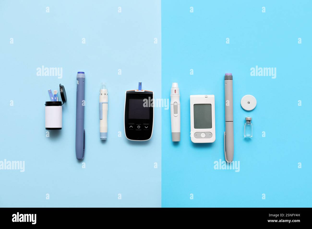 Modern glucometers with lancet pens and insulin ampule on color ...
