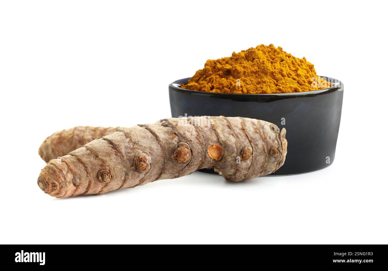 Turmeric powder in black Cut Out Stock Images & Pictures - Alamy